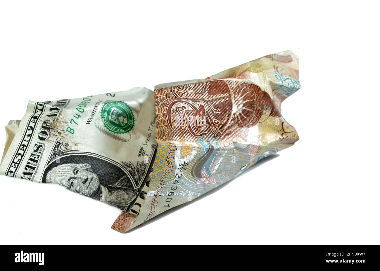 Money inflation and losing value, drop concept, Crumpled Kuwaiti money ...