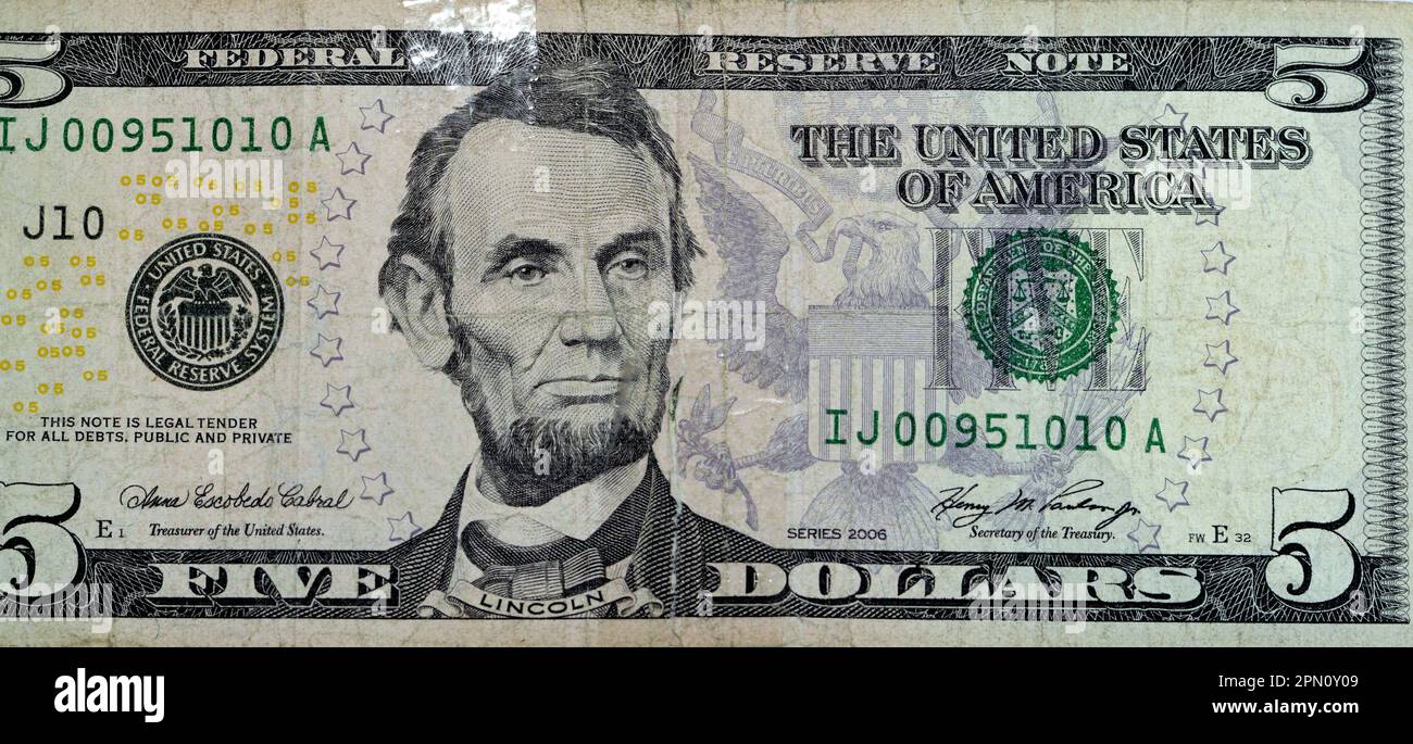 Large fragment of the obverse side of a torn 5 five dollars bill ...