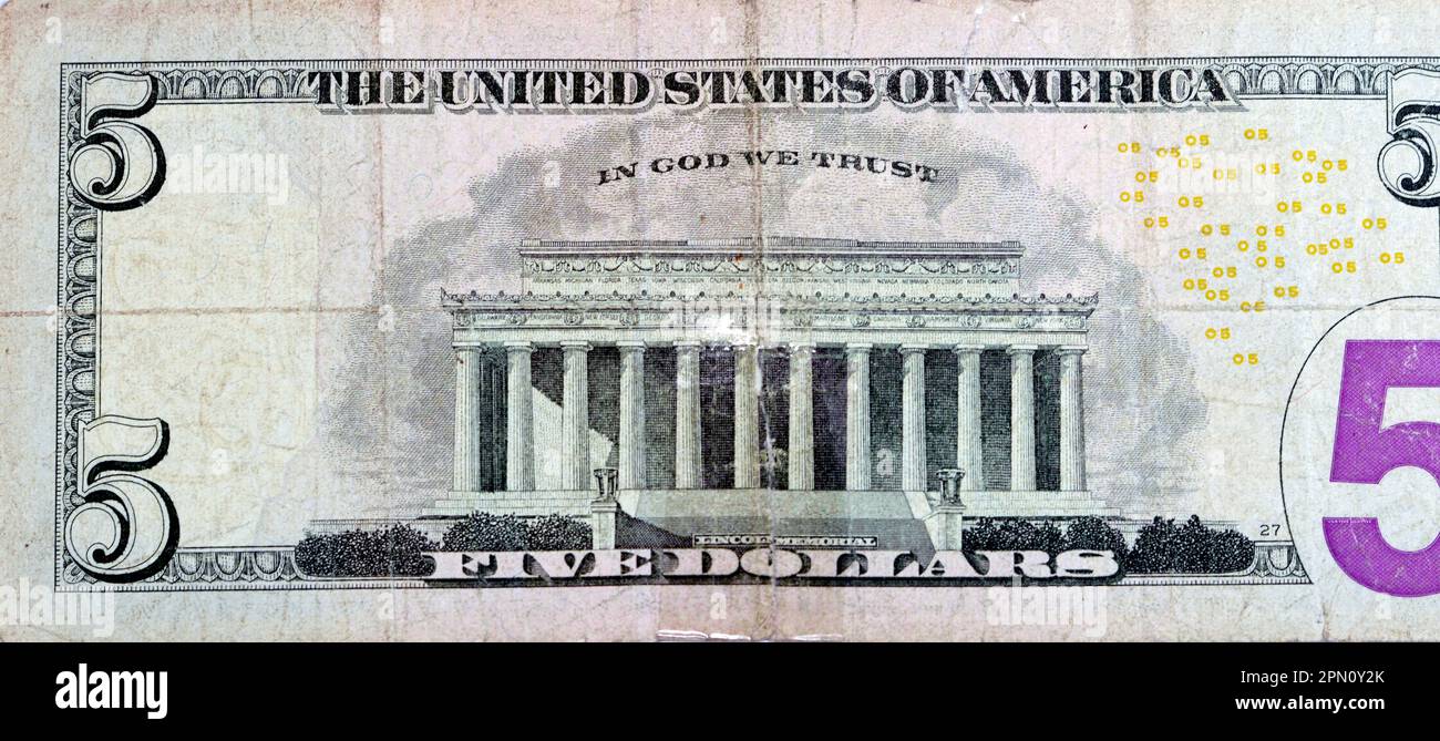Large fragment of the reverse side of a torn 5 five dollars bill ...