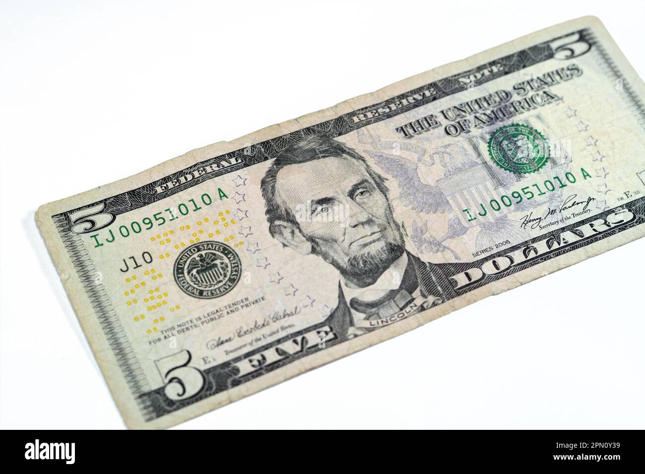 Obverse side of a torn 5 five dollars bill banknote repaired with ...