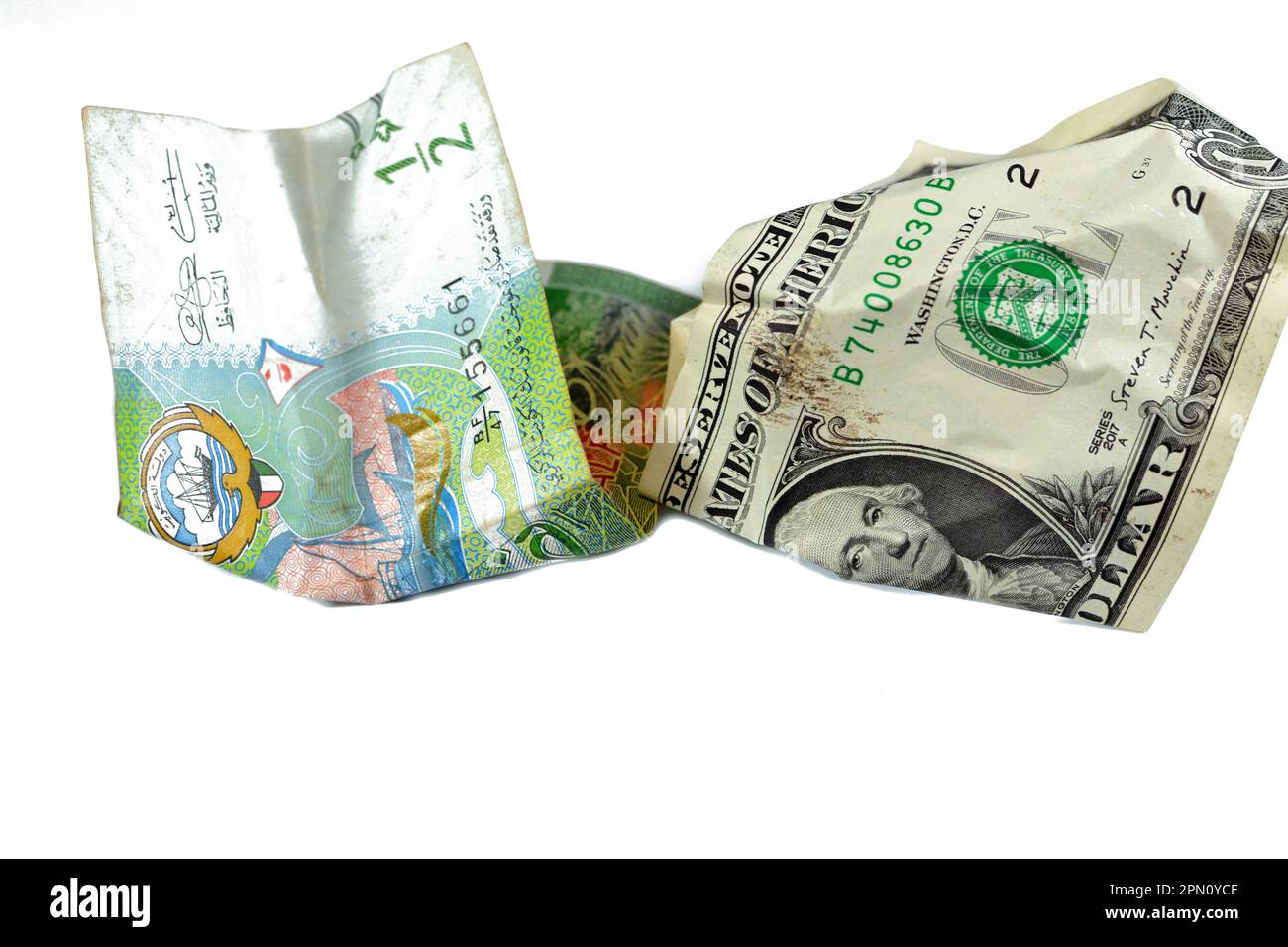 Wrinkled and crumpled Kuwaiti half KWD dinar bill banknote and 1 one ...
