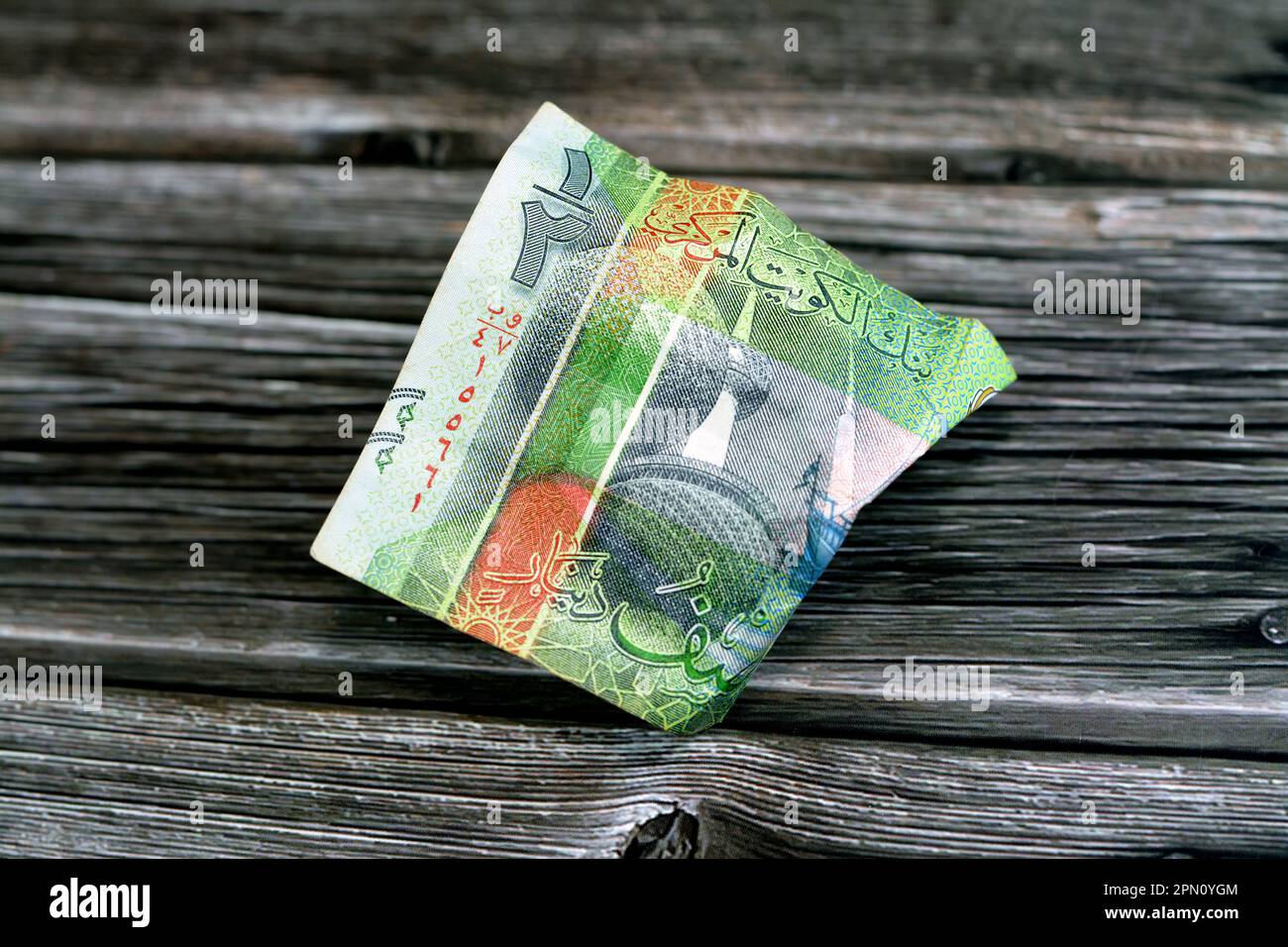 Selective focus of crumpled Kuwaiti money of Half KWD Kuwait dinar bill ...