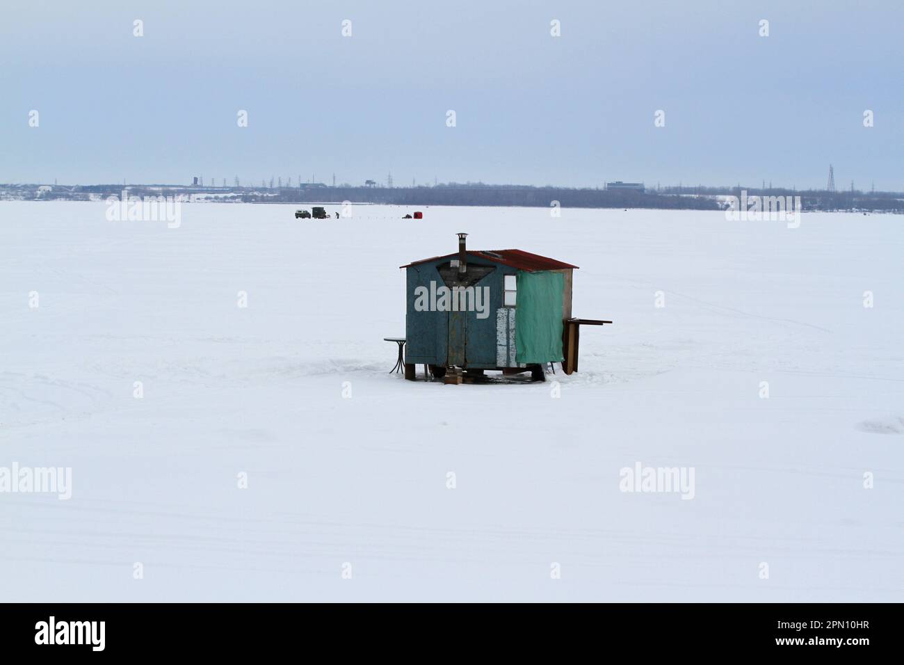 Ice fishing cabin on frozen lake Stock Photo - Alamy