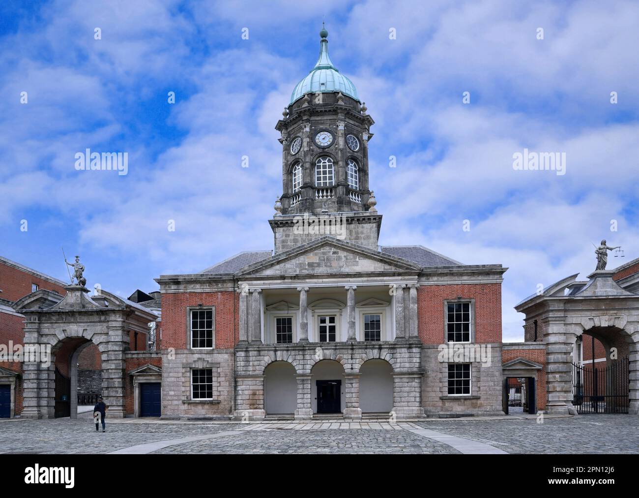 Dublin Castle, clocktower and gatehouse viewed from cobblestoned ...