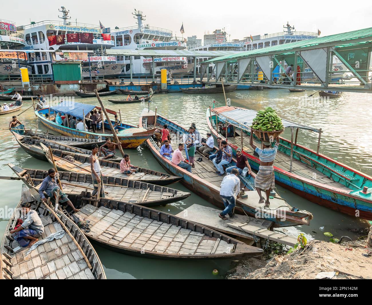 Ferries of different sizes at Wise Ghat Boat Station on Buriganga River ...