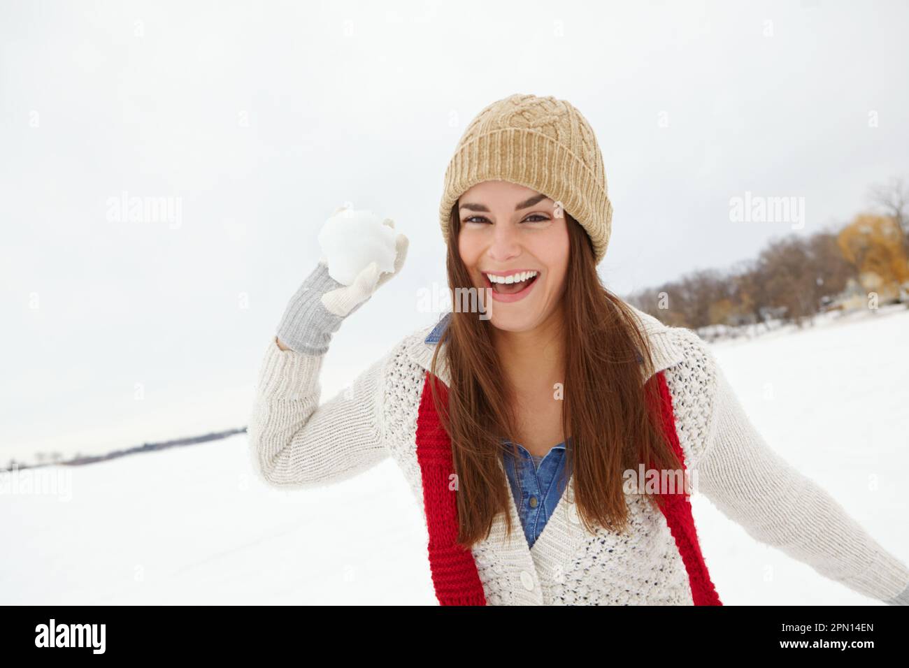 Over here. Portrait of an attractive young woman about to throw a ...