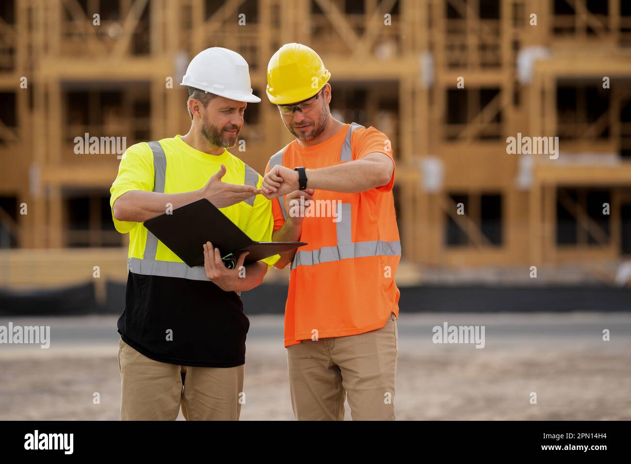 architect men checking construction project outdoor. architect men have ...