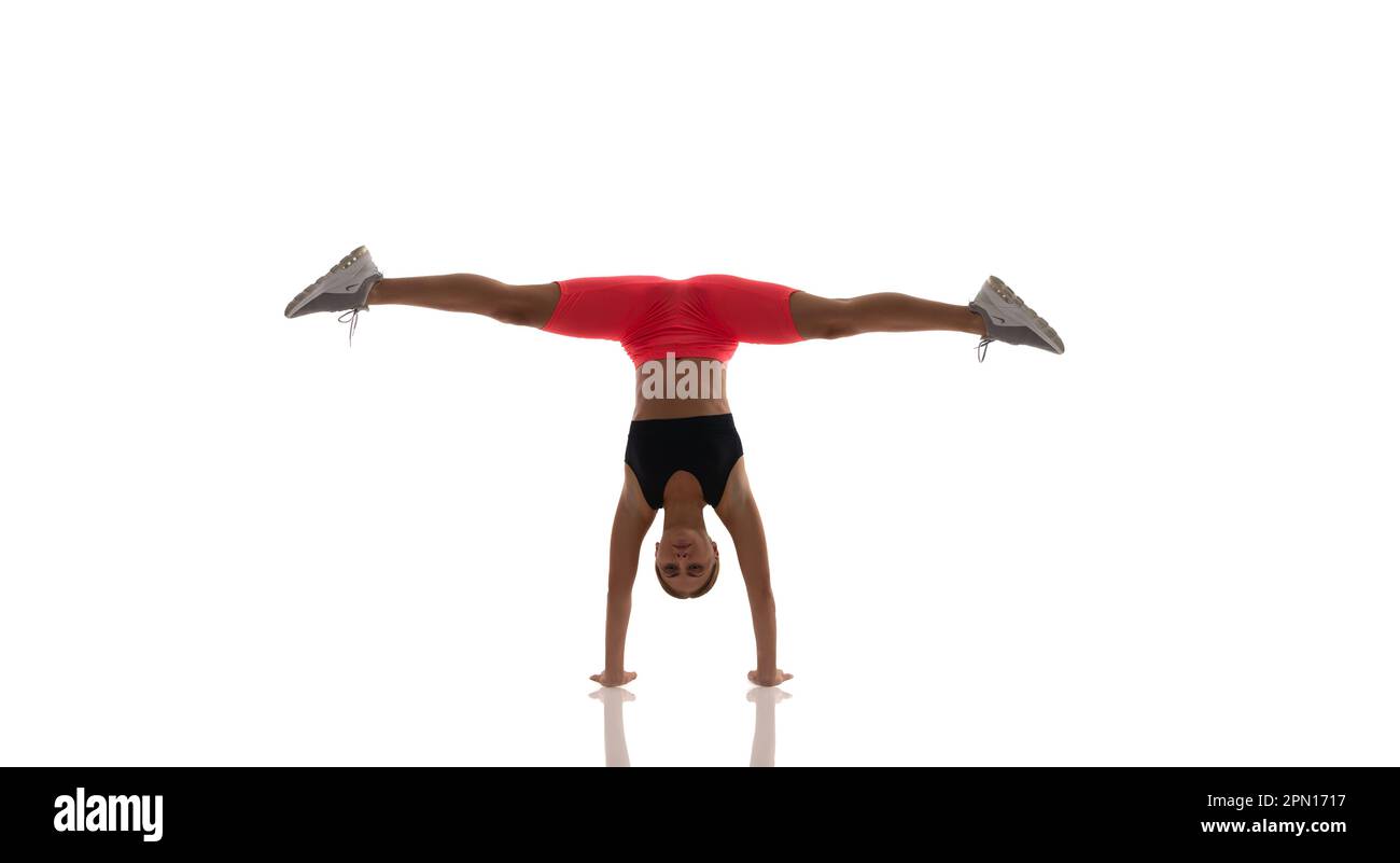 sport woman do split isolated on white. sport woman do split in studio ...