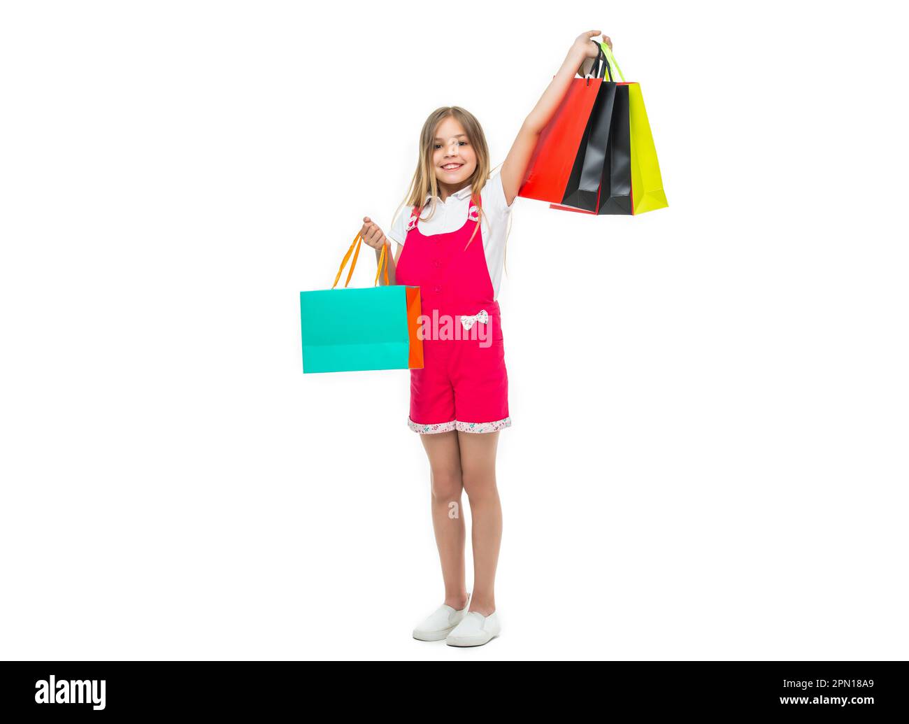 positive teen girl with shopping bag in studio. teen girl with shopping ...