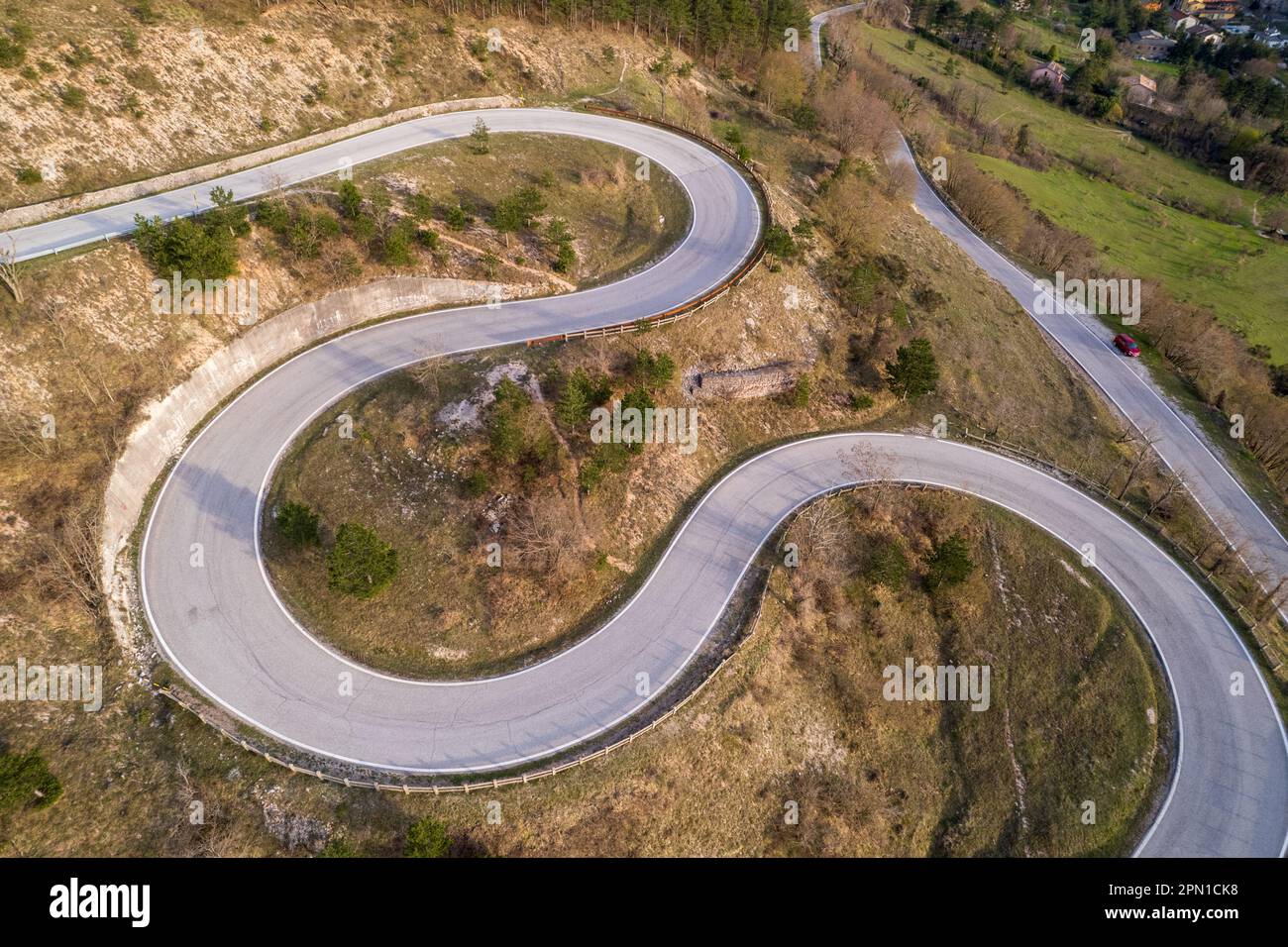Aerial view of curvy road on monte Nerone slope in Marche region in ...