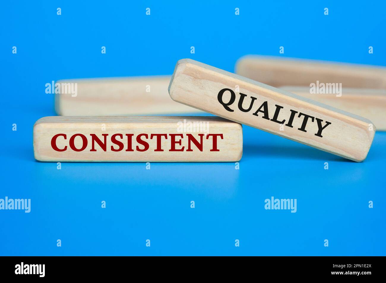 Consistent quality text on wooden blocks. Business culture and ...