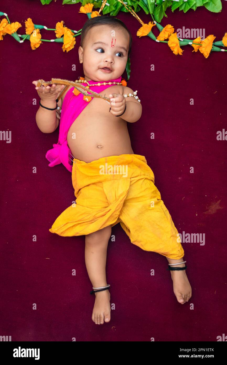 cute Indian boy dresses as lord rama with bow and flowers from top ...
