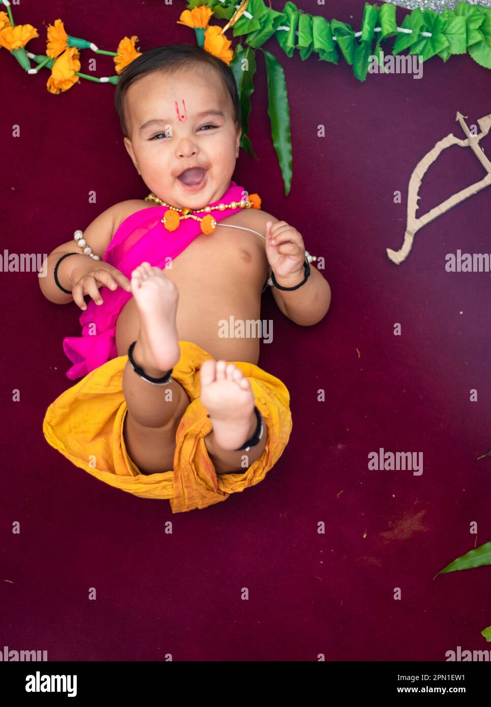 cute Indian boy dresses as lord rama with bow and flowers from top ...