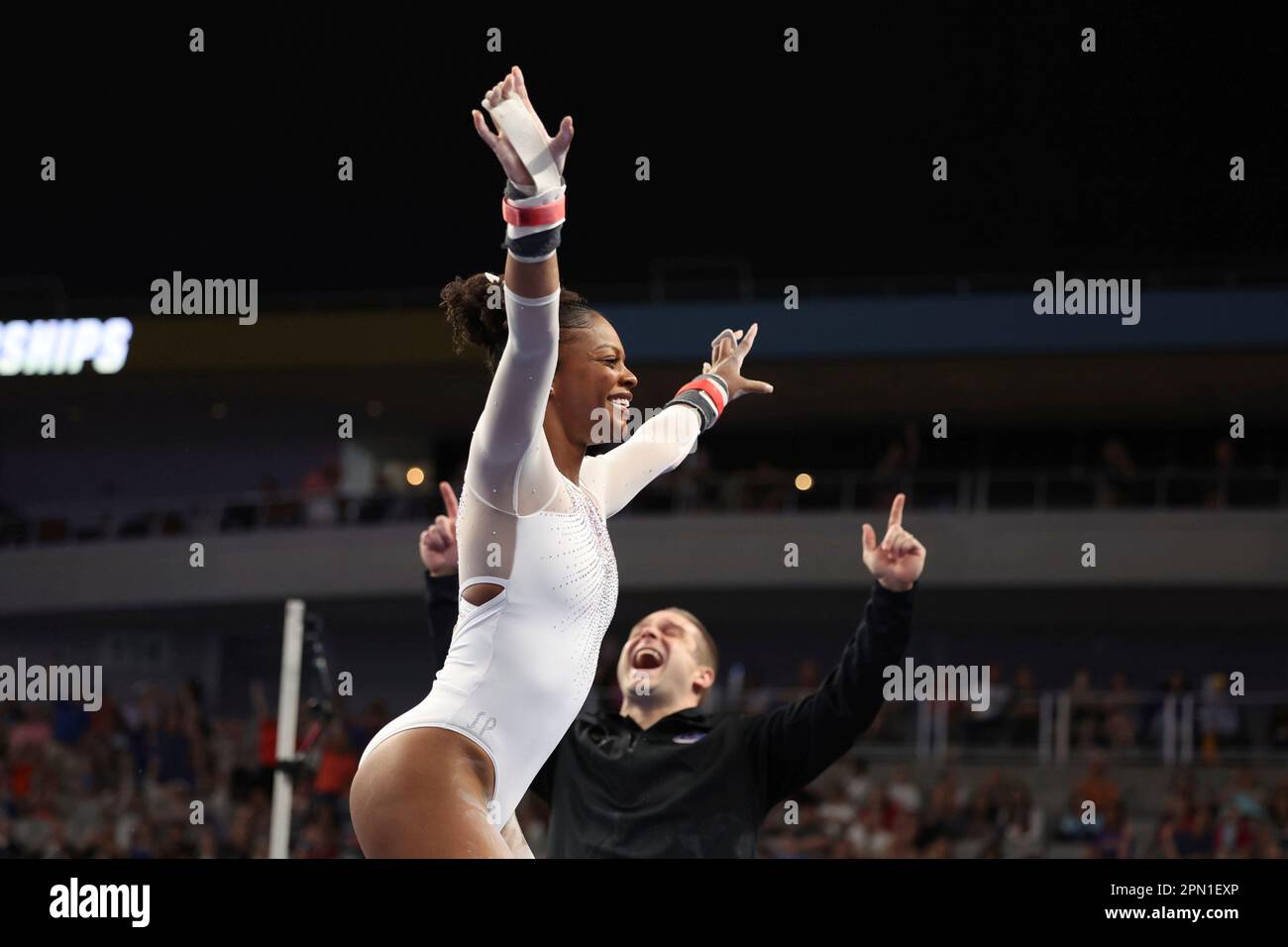 April 15, 2023: Trinity Thomas completes her final uneven bars routine ...