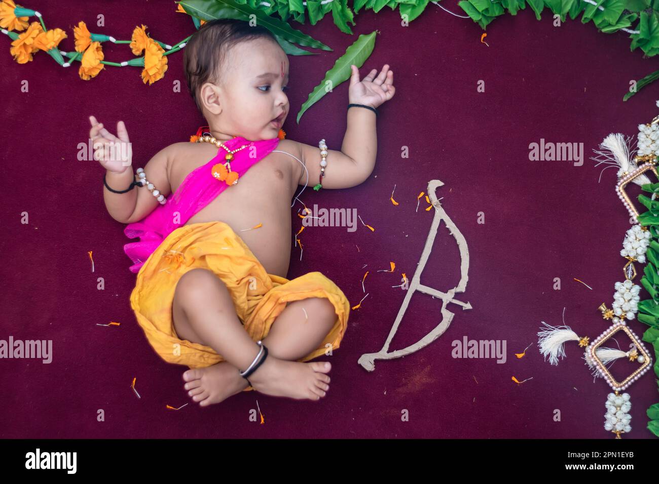 cute Indian boy dresses as lord rama with bow and flowers from top ...