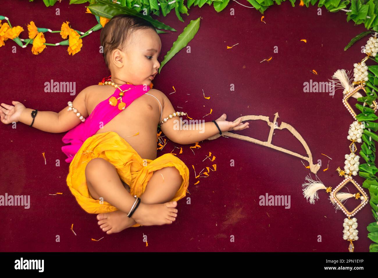 cute Indian boy dresses as lord rama with bow and flowers from top ...