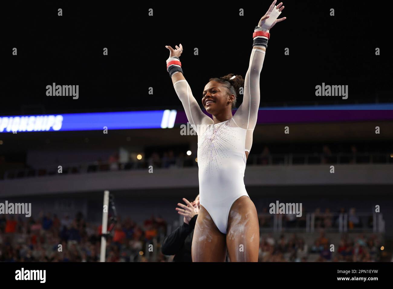 April 15, 2023: Trinity Thomas completes her final uneven bars routine ...