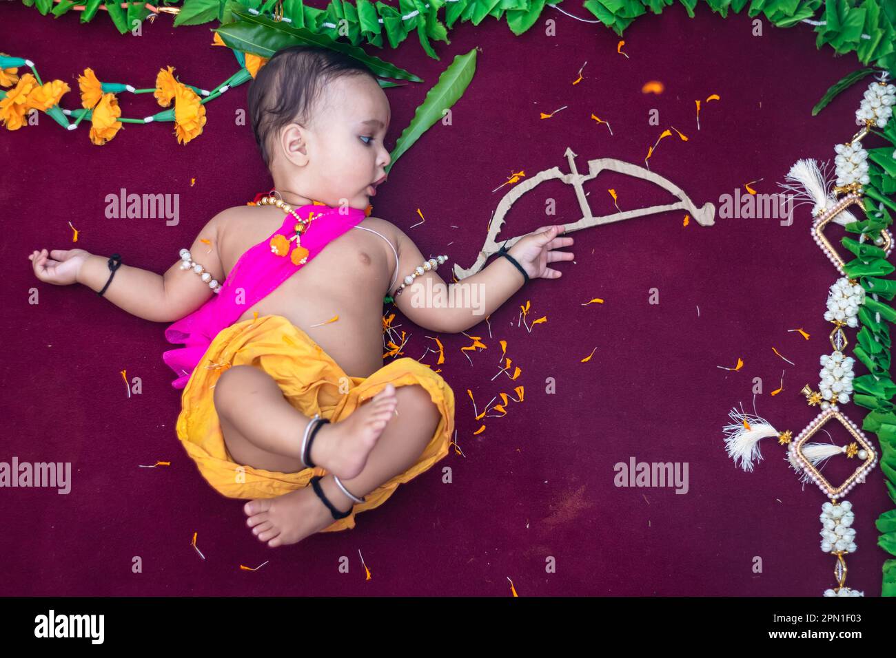 cute Indian boy dresses as lord rama with bow and flowers from top ...