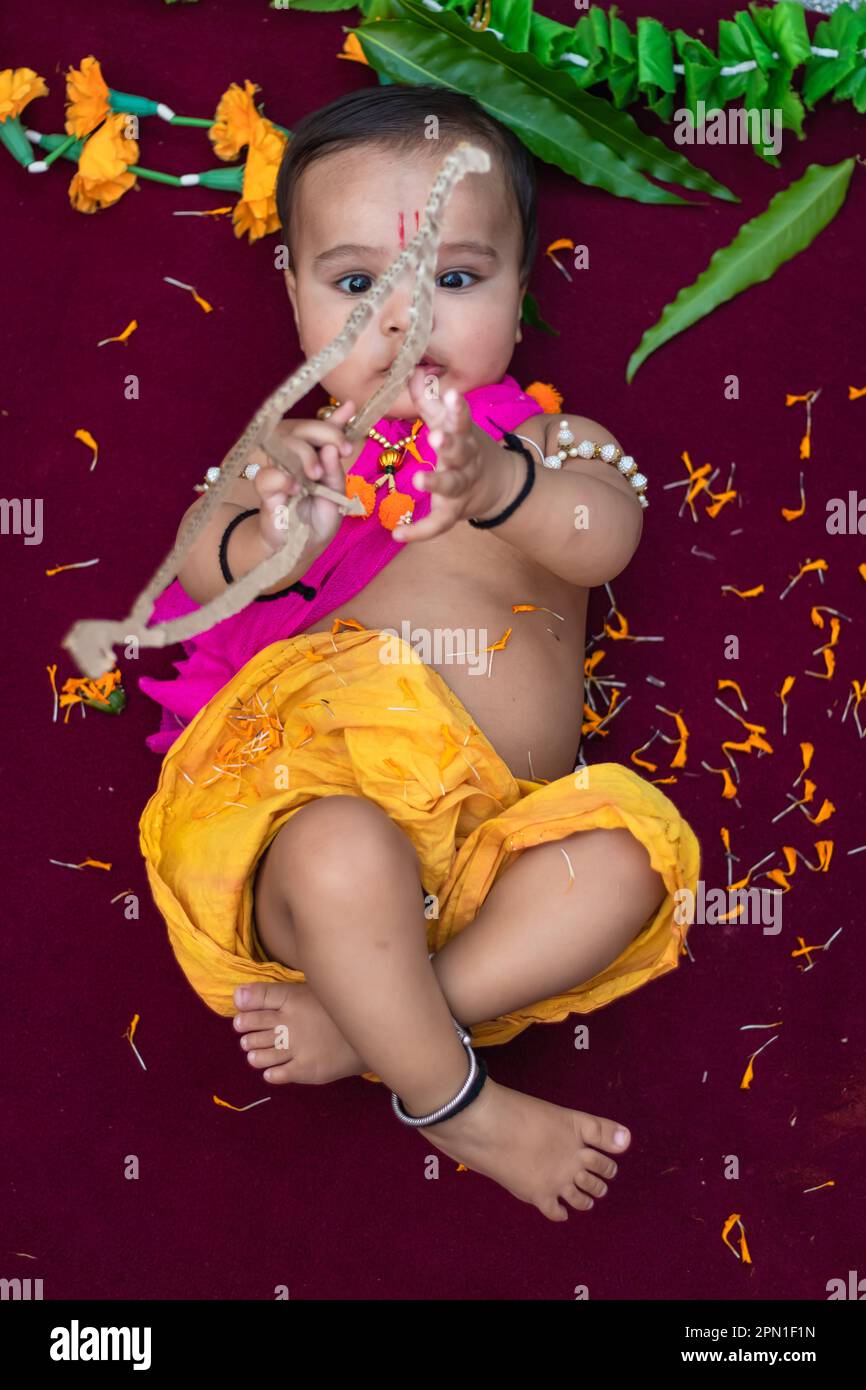 cute Indian boy dresses as lord rama with bow and flowers from top ...