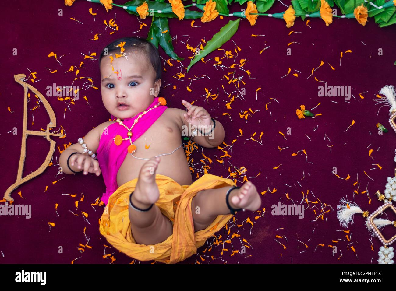 cute Indian boy dresses as lord rama with bow and flowers from top ...