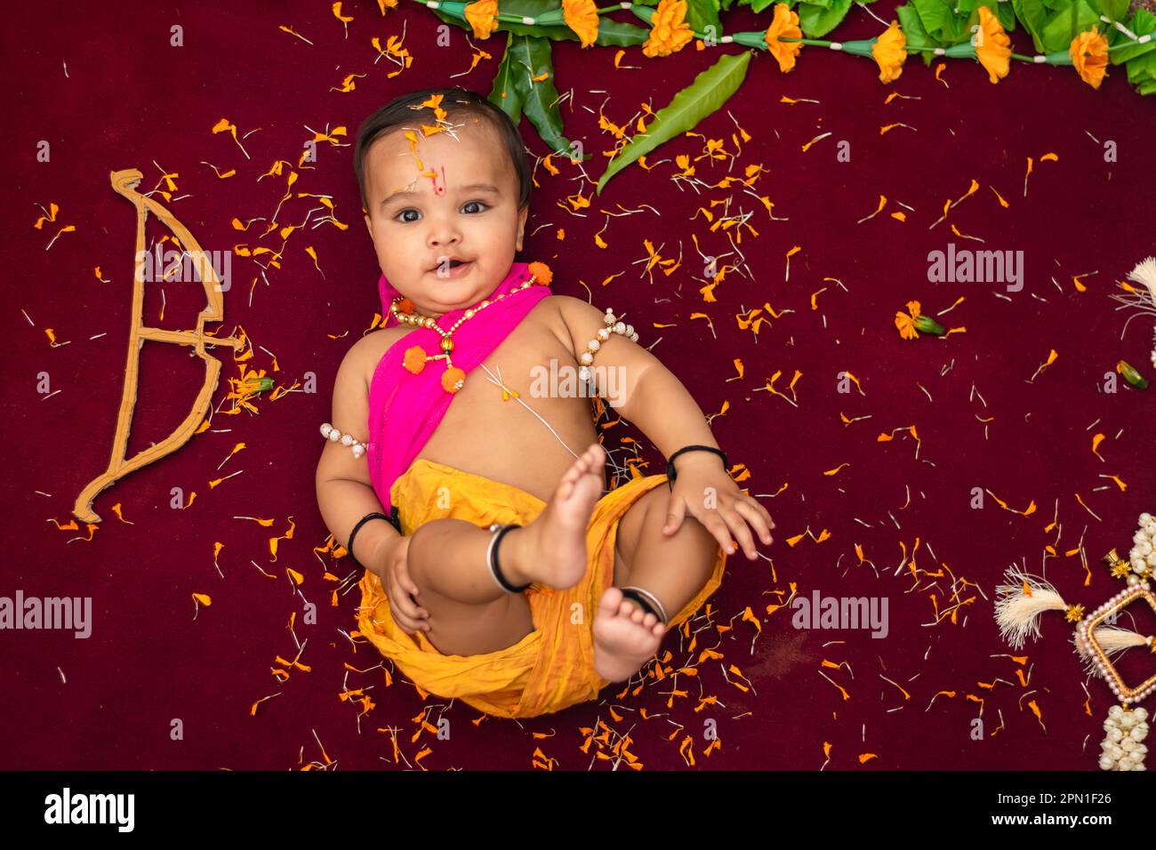 cute Indian boy dresses as lord rama with bow and flowers from top ...