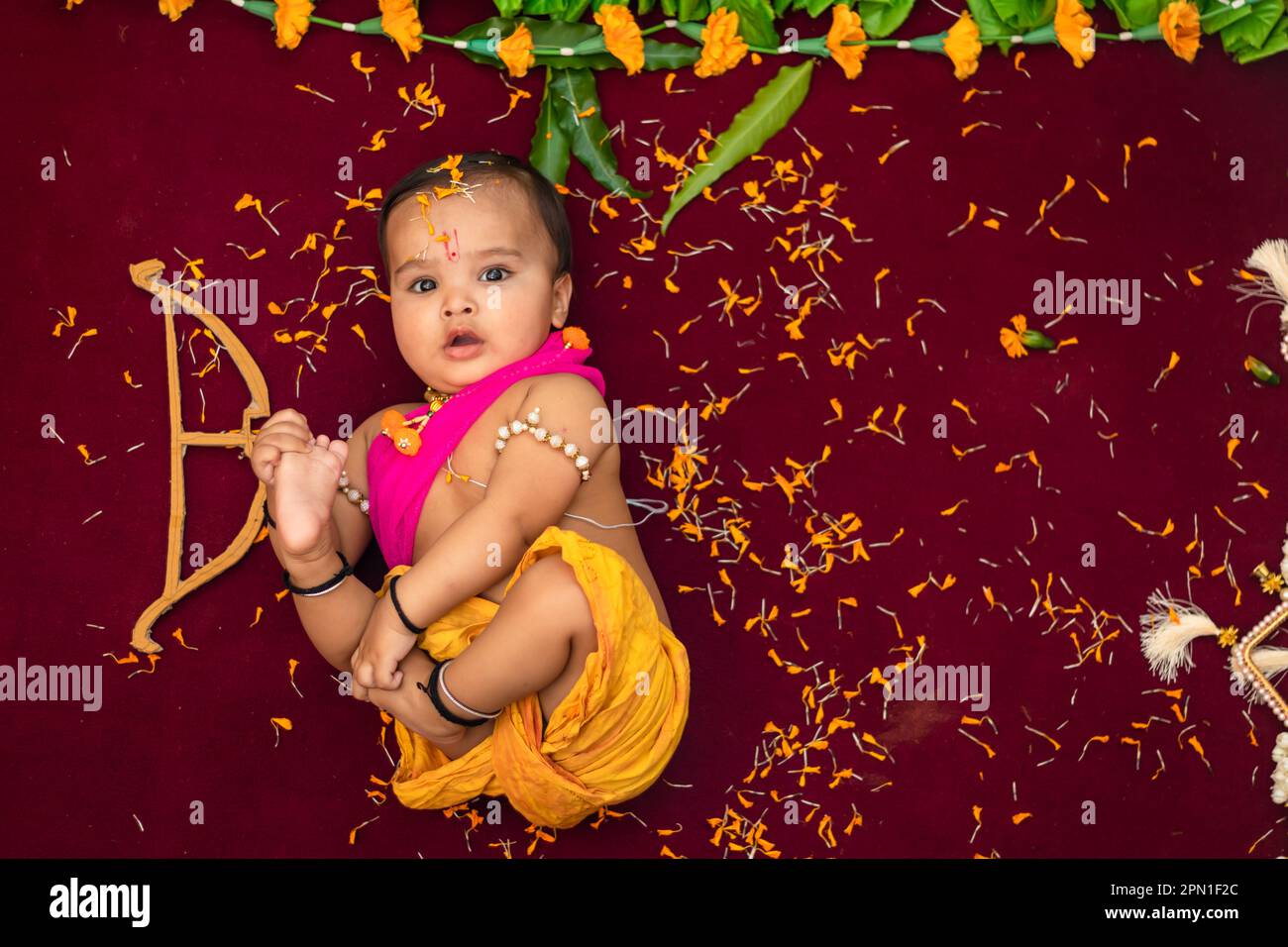 cute Indian boy dresses as lord rama with bow and flowers from top ...