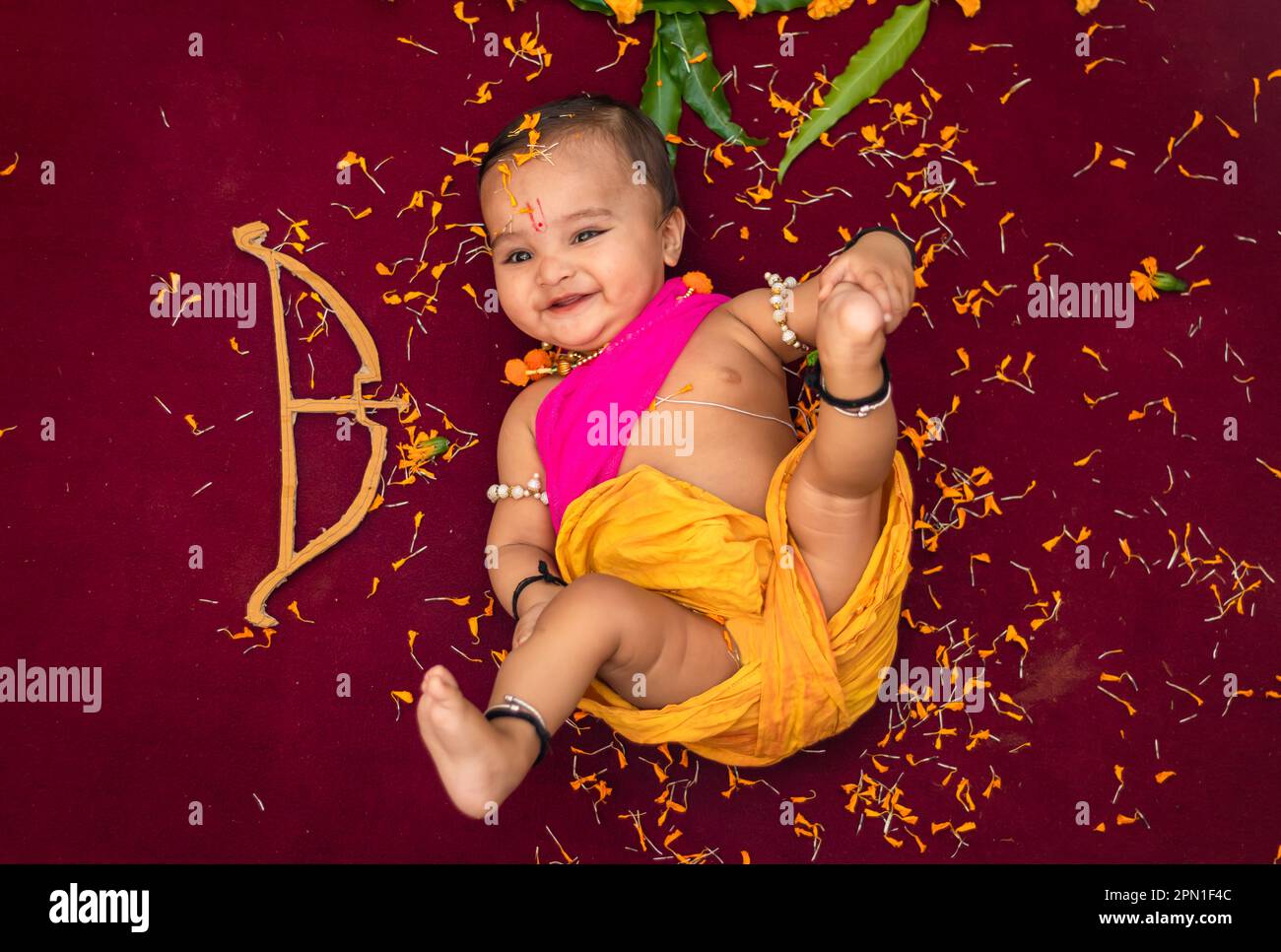 cute Indian boy dresses as lord rama with bow and flowers from top ...