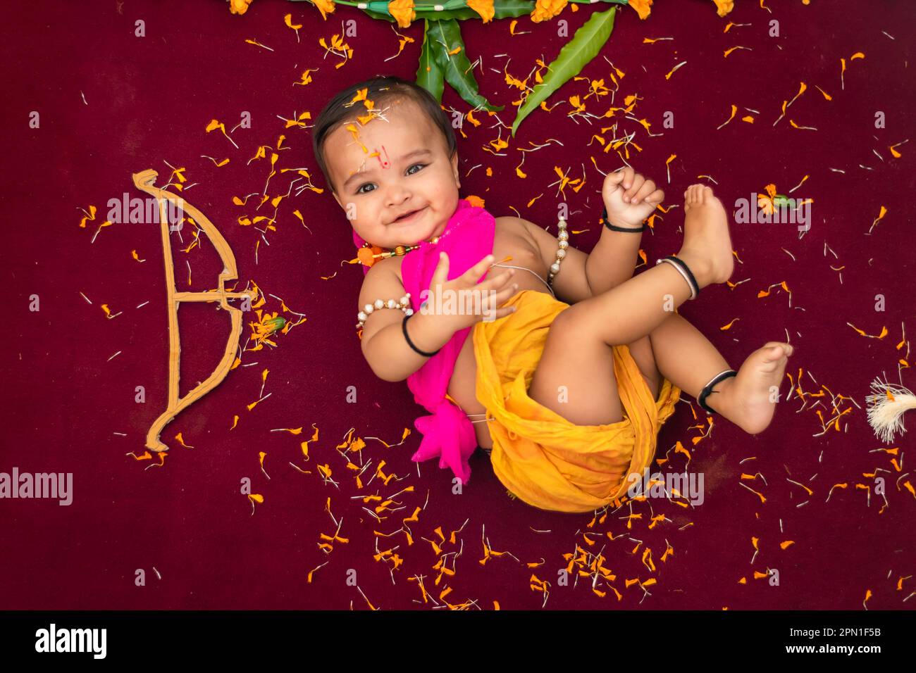 cute Indian boy dresses as lord rama with bow and flowers from top ...