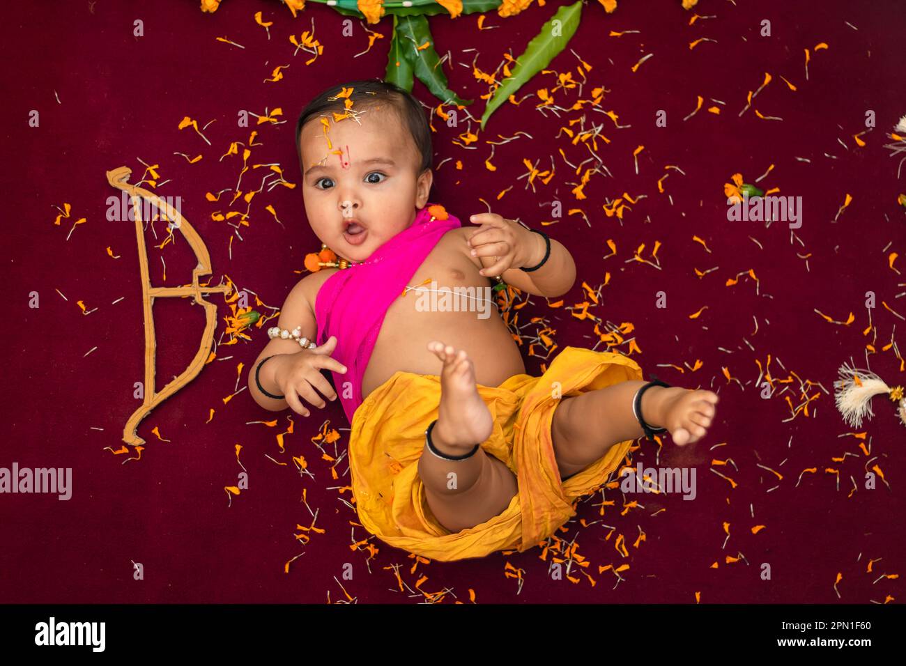 cute Indian boy dresses as lord rama with bow and flowers from top ...