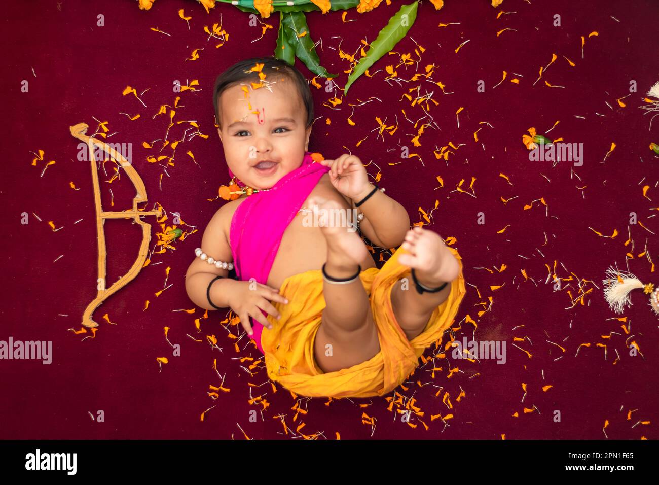 cute Indian boy dresses as lord rama with bow and flowers from top ...