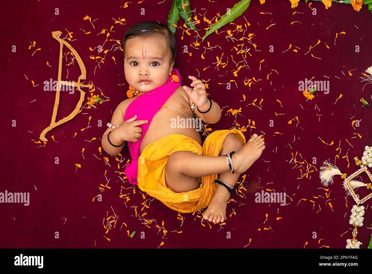 cute Indian boy dresses as lord rama with bow and flowers from top ...