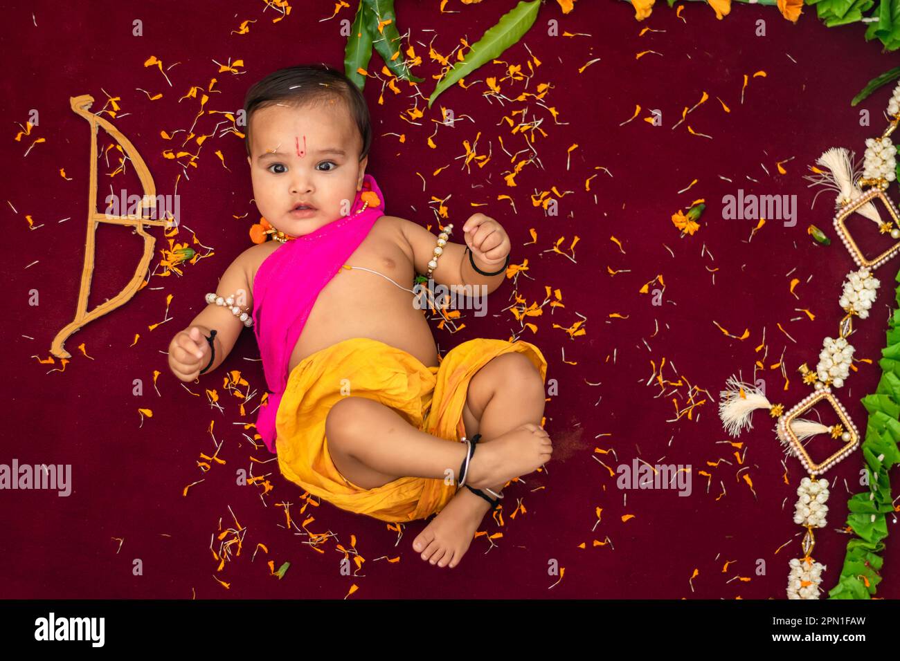 cute Indian boy dresses as lord rama with bow and flowers from top ...