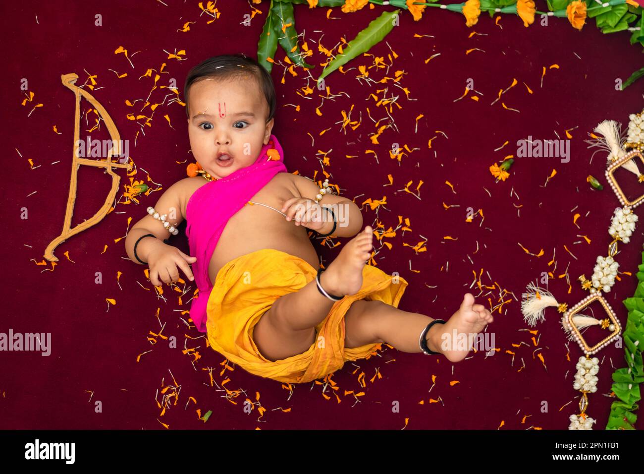 cute Indian boy dresses as lord rama with bow and flowers from top ...