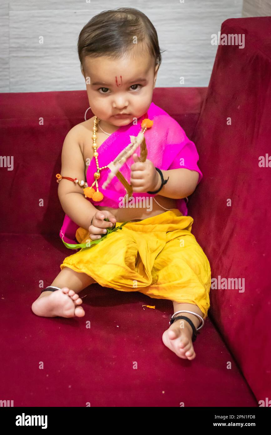 cute Indian boy dresses as lord rama with bow and flowers from top ...