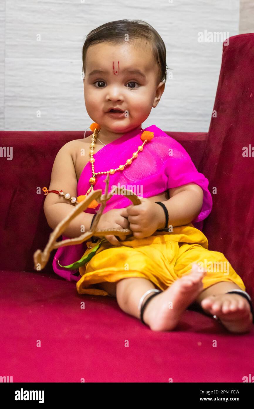 cute Indian boy dresses as lord rama with bow and flowers from top ...