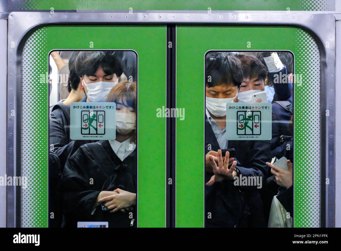 Tokyo, Japan. 14th Apr, 2023. People are traveling inside the crowded train of the Yamanote Line ...