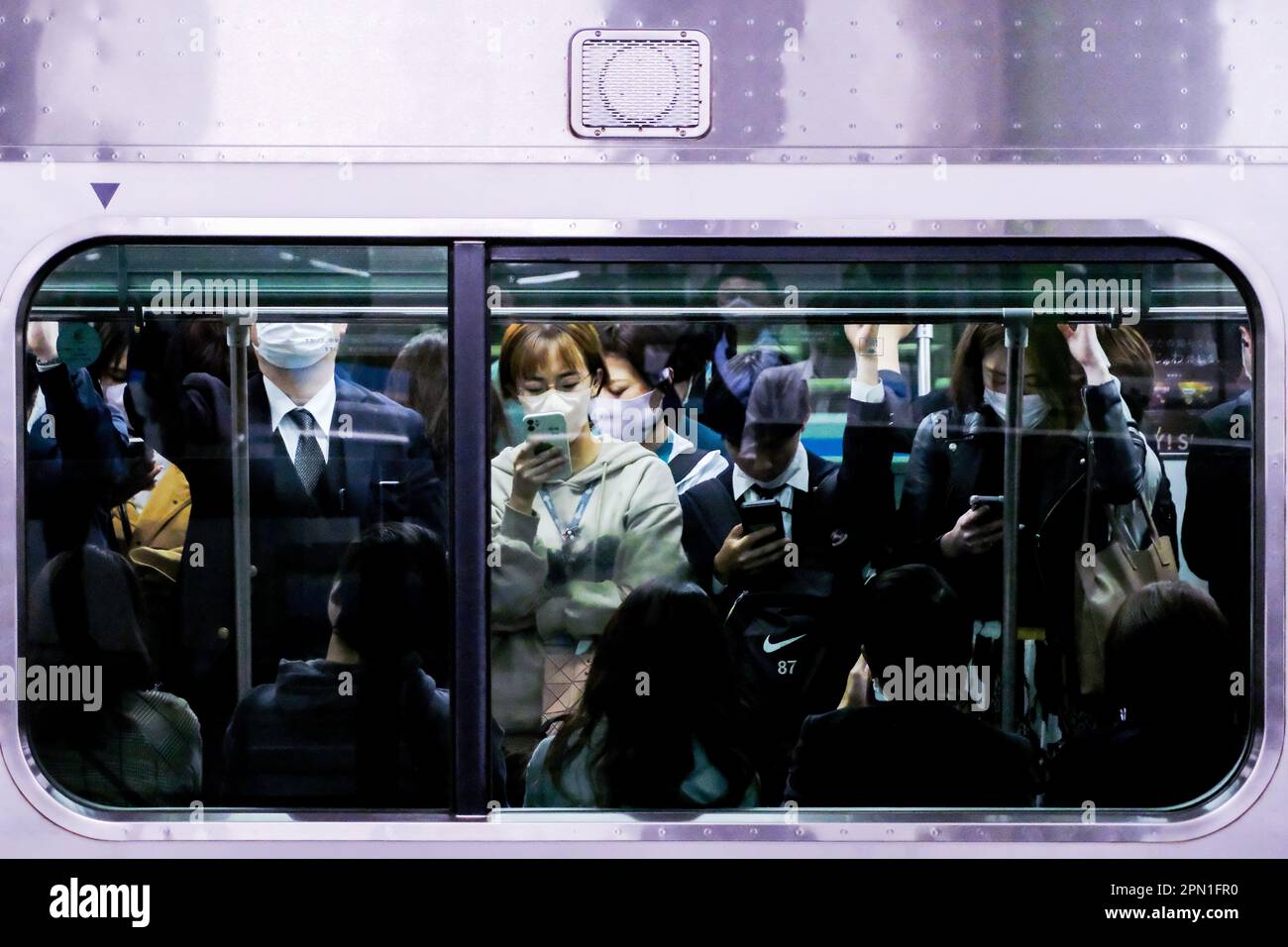 Tokyo, Japan. 14th Apr, 2023. People are traveling inside the crowded train of the Yamanote Line ...