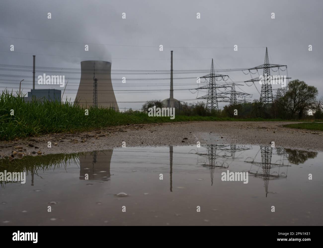Munich, Germany. 16th Apr, 2023. Steam rises from the cooling tower of ...
