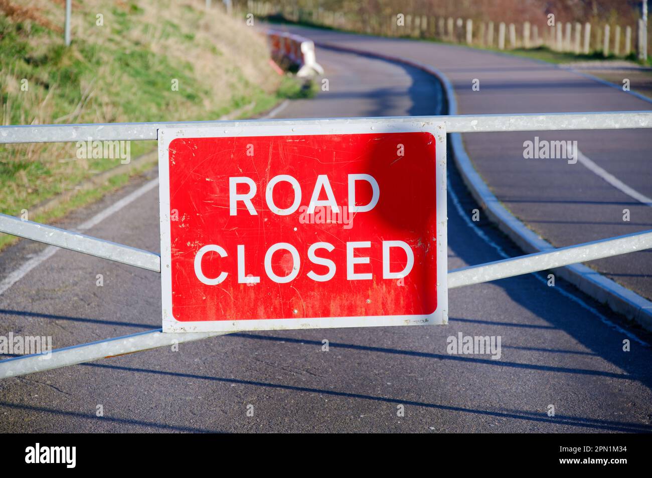 Road ahead closed sign and barrier fence crossing Stock Photo - Alamy