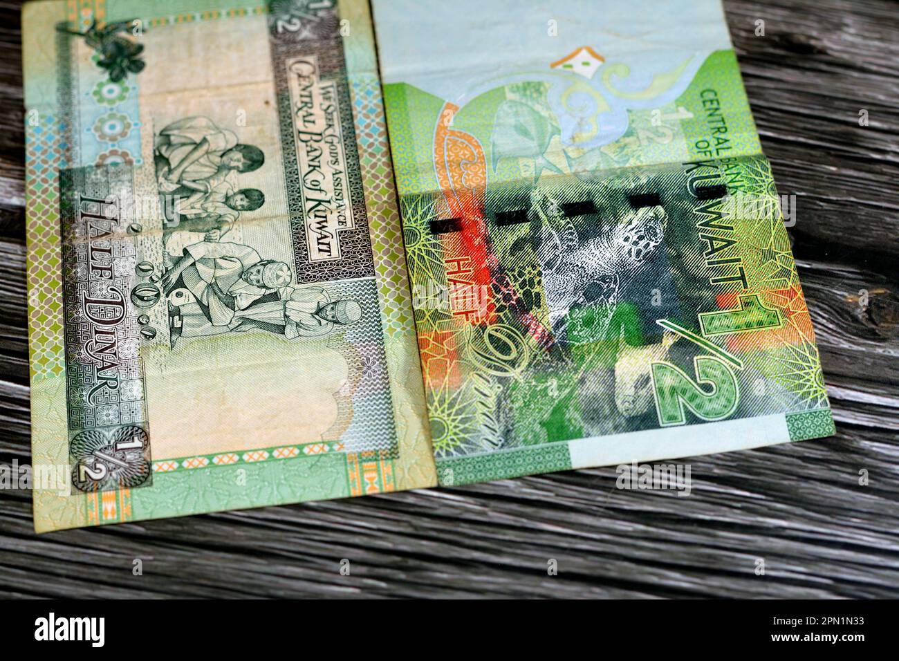Old and new Kuwaiti half dinar bill banknotes money coat of arms of ...