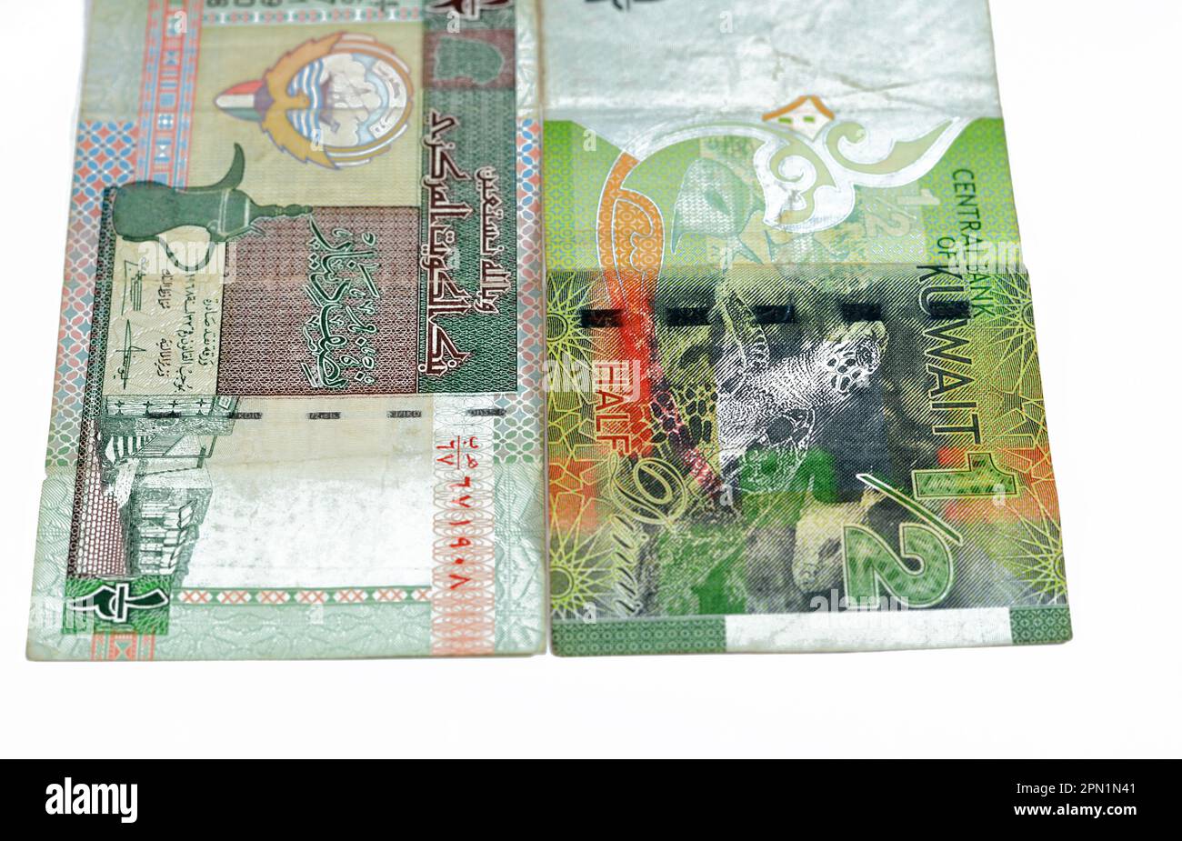 Old and new Kuwaiti half dinar bill banknotes money coat of arms of ...