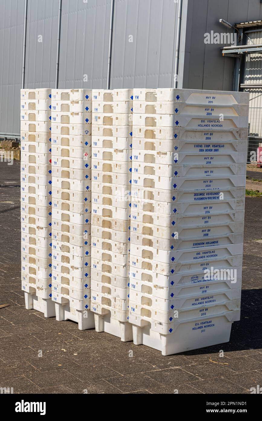 Many plastic bins stacked on top of each other are used in the ...