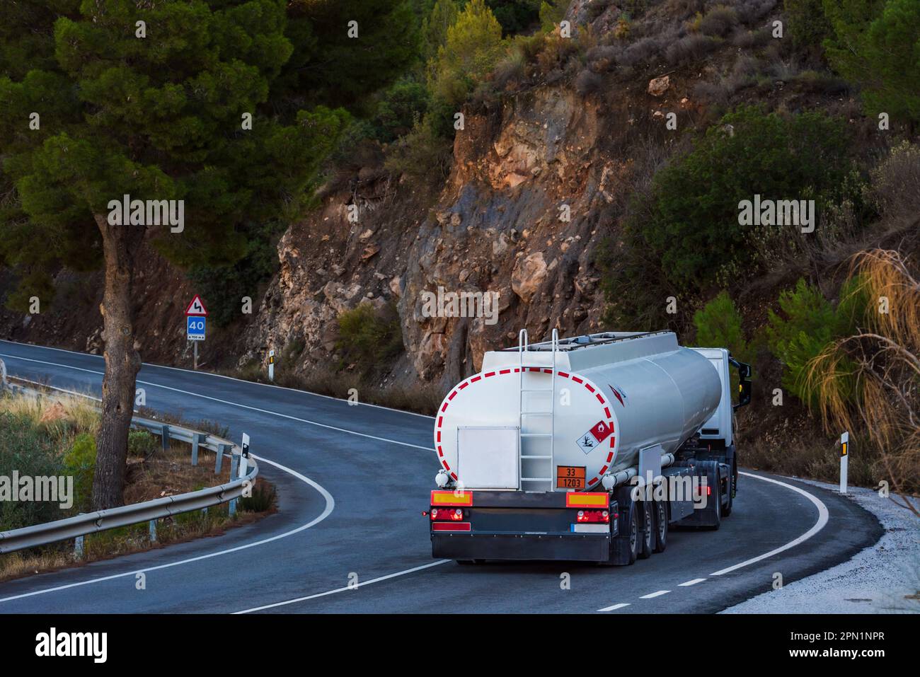 Fuel tanker truck driving on a mountain road Stock Photo - Alamy