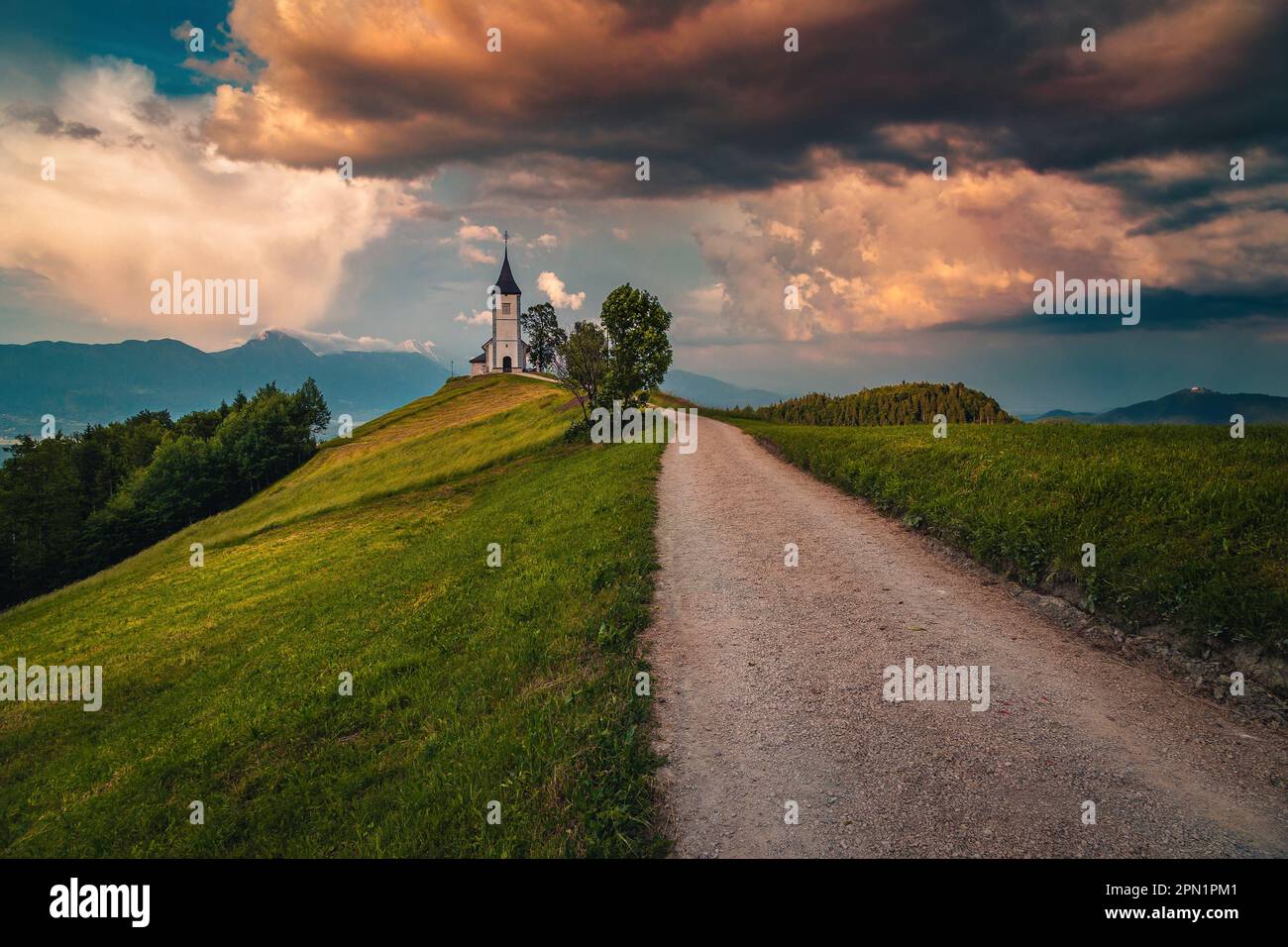 Rural landscape with cute small church on the mountain ridge. Dark ...