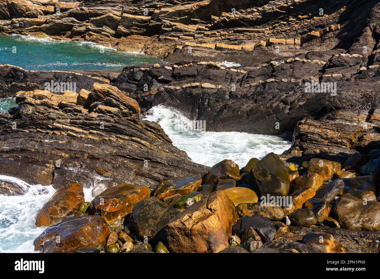 Rock formations of strange shapes where the waves break creating ...