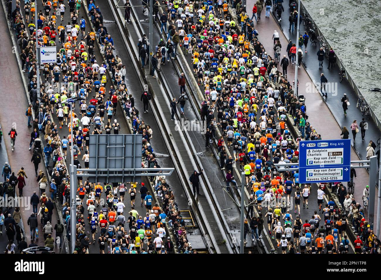 ROTTERDAM - Participants run across the Erasmus Bridge during the 42nd ...
