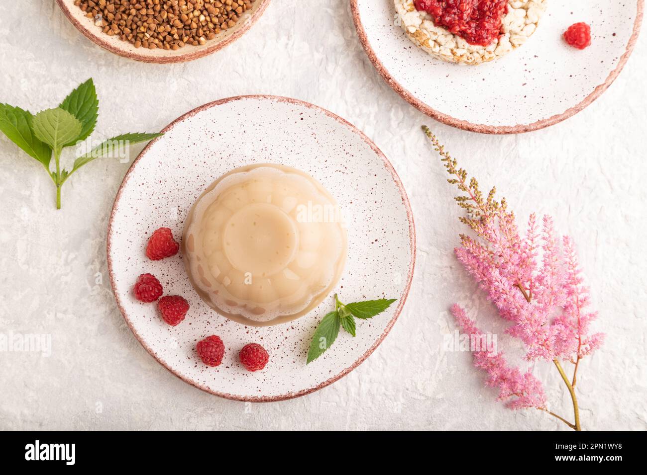 Buckwheat milk jelly on gray concrete background. top view, flat lay ...