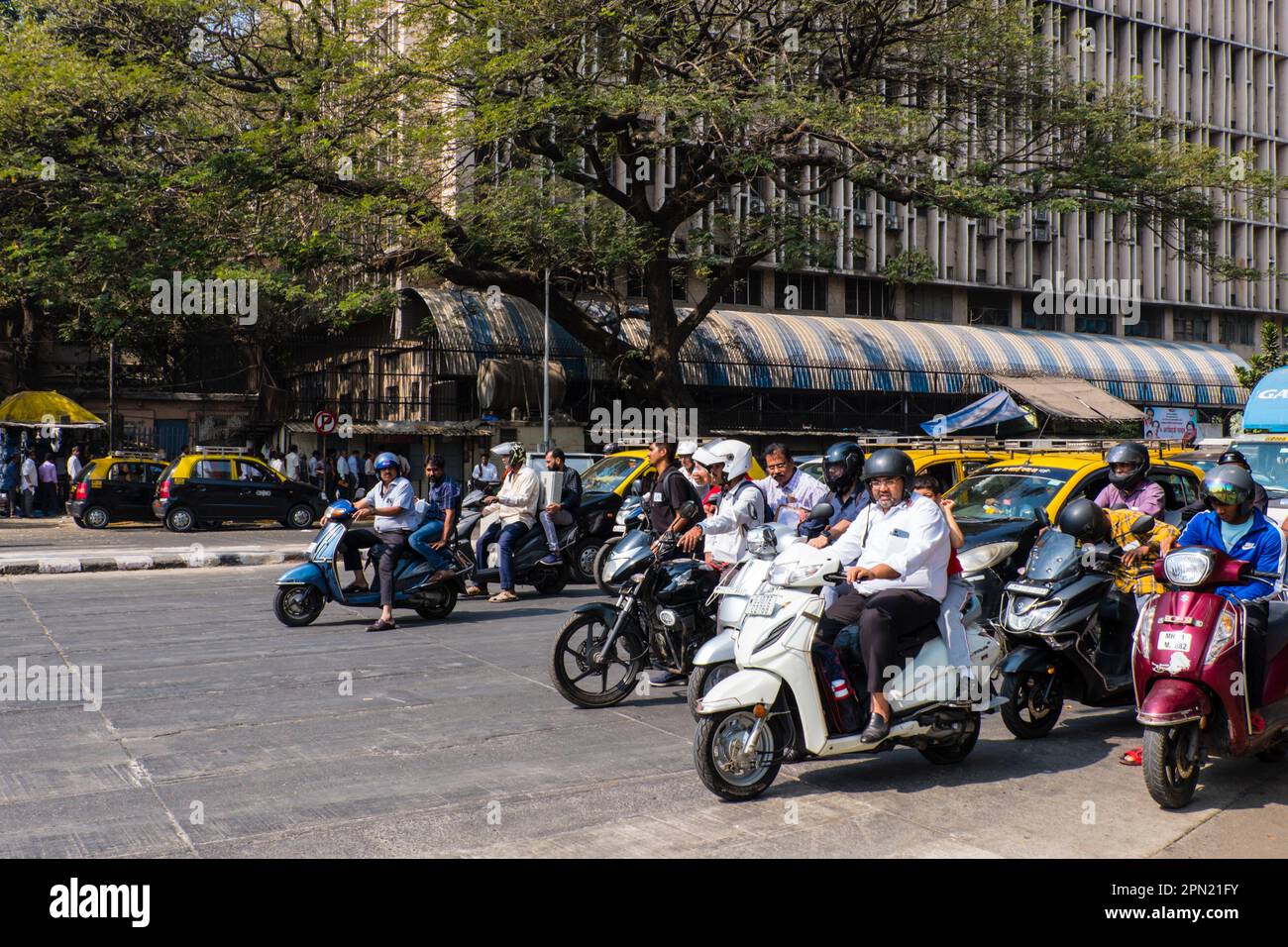 Scooters waiting in traffic lights, Churchgate, Mumbai, India Stock Photo - Alamy