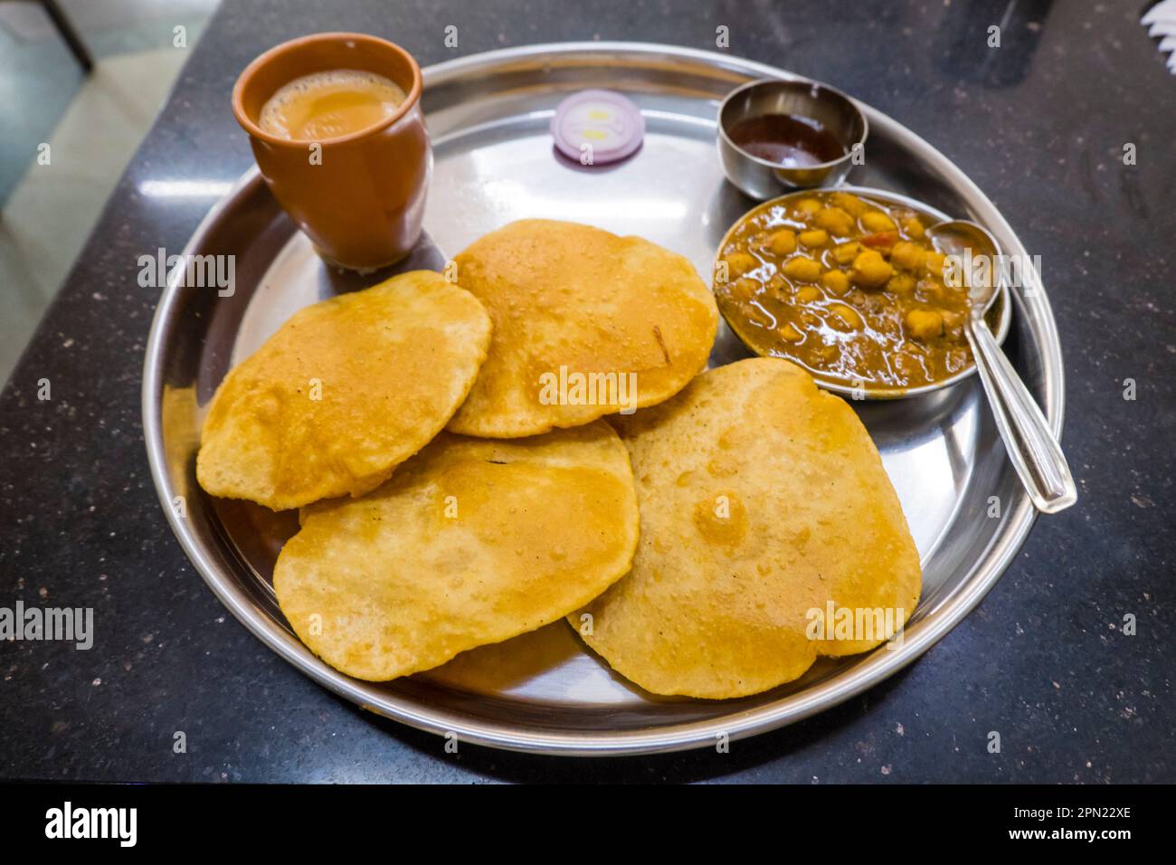 Chole puri, with tea, Mumbai, India Stock Photo - Alamy