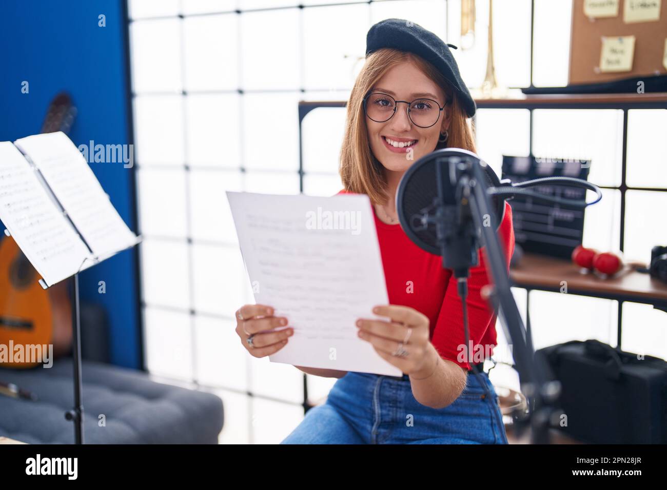 Young redhead woman artist singing song at music studio Stock Photo - Alamy